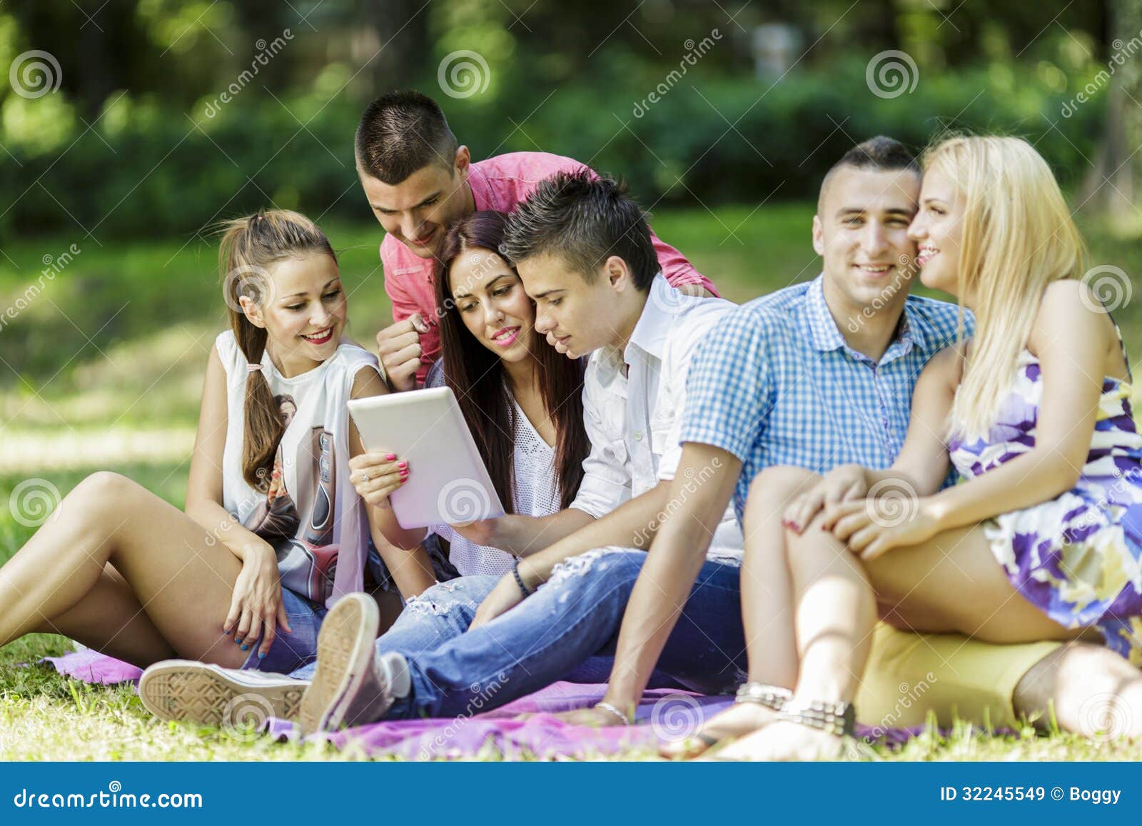 Teenagers in the park stock image. Image of internet - 32245549