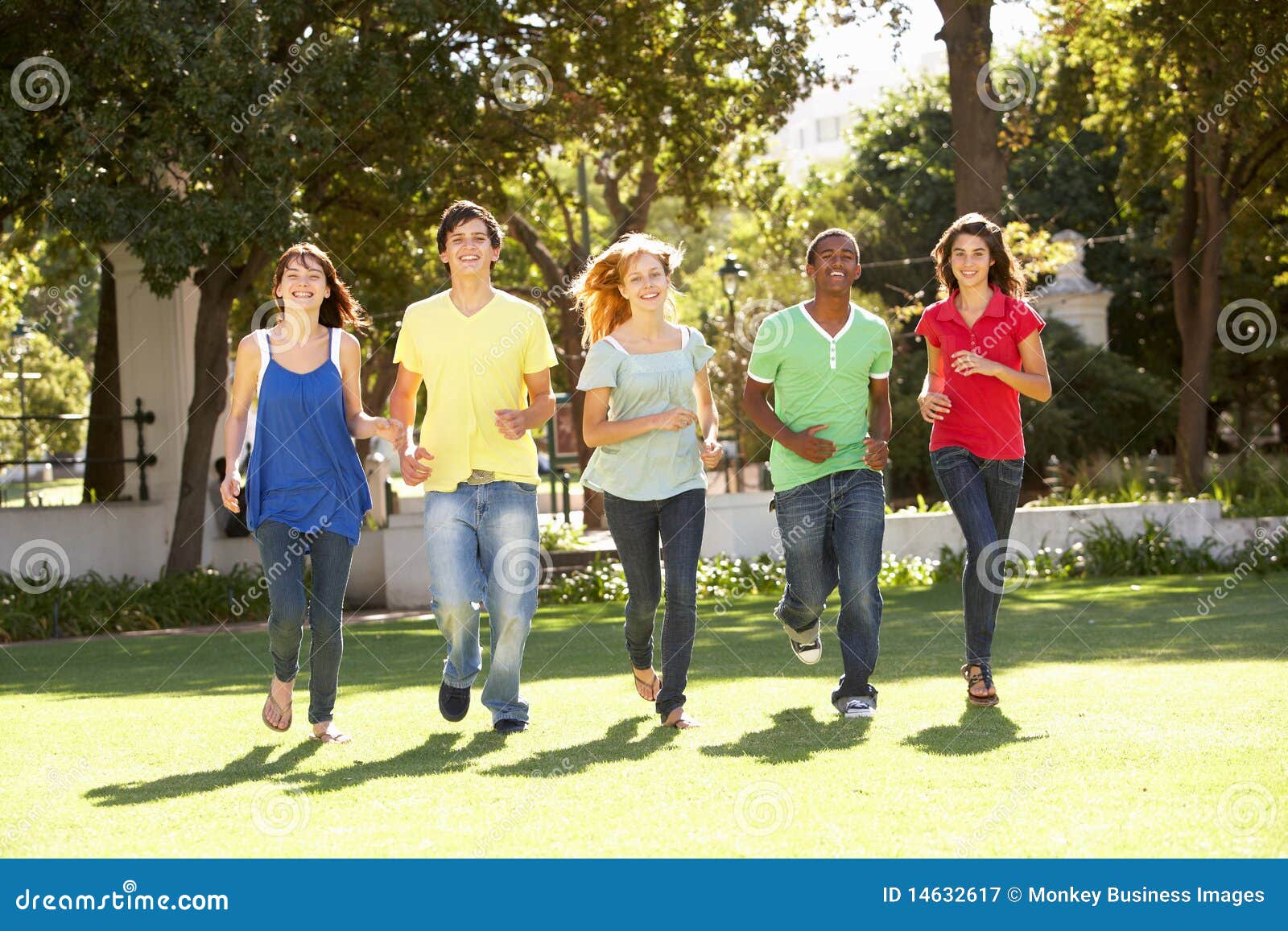Teenagers Running through Park Stock Image - Image of full, length ...