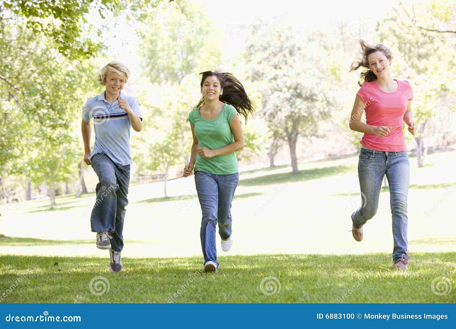 Teenagers Running through Park Stock Photo - Image of people, colour ...