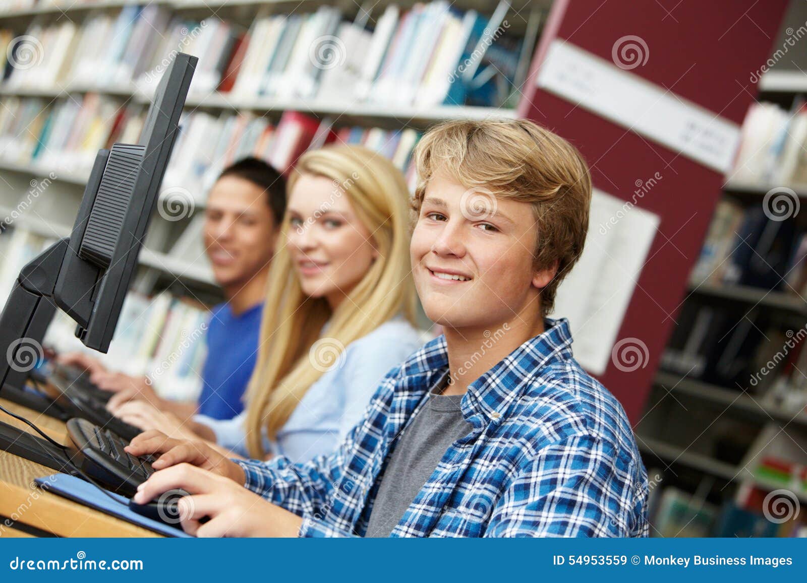 Teenagers Working on Computers in Library Stock Image - Image of ...