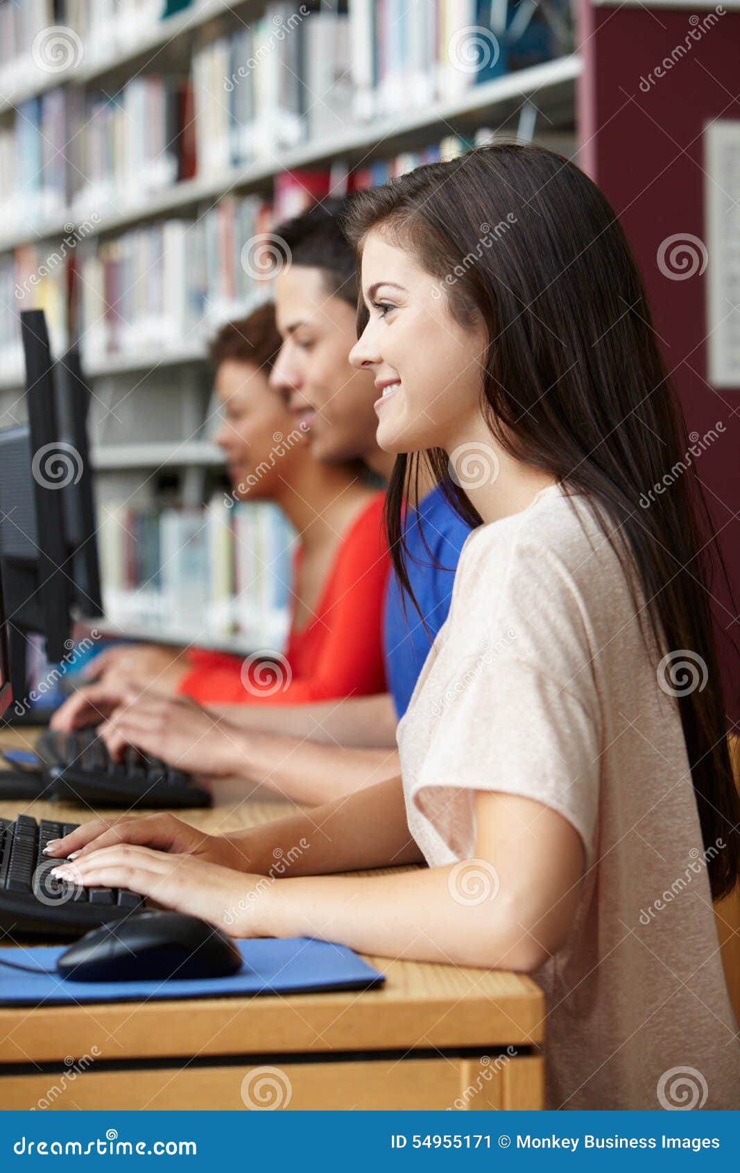 Teenagers Working on Computers in Library Stock Image - Image of girls ...