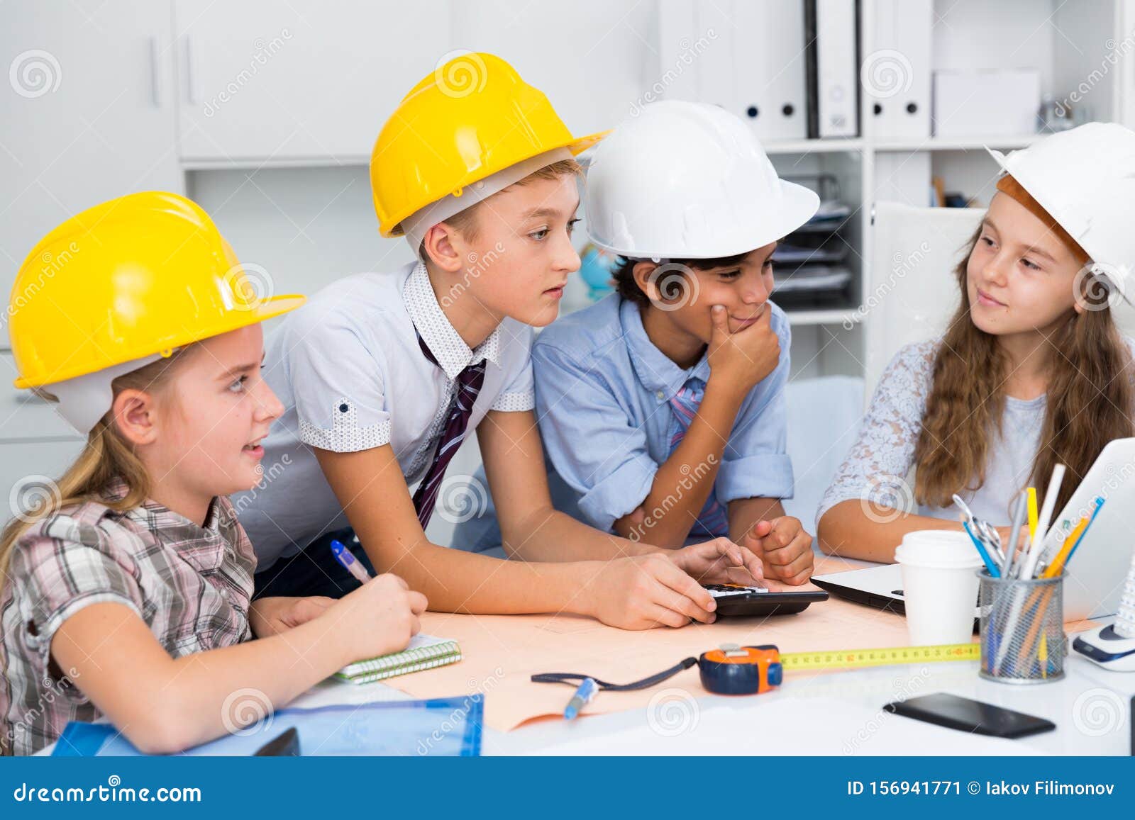 Teens Engineers Discussing Draft at the Table Stock Image - Image of ...