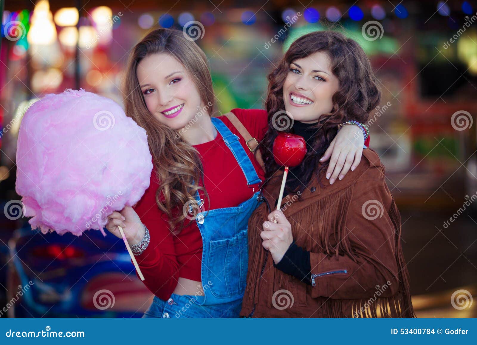 Teens at fair with candy stock photo. Image of amusement - 53400784