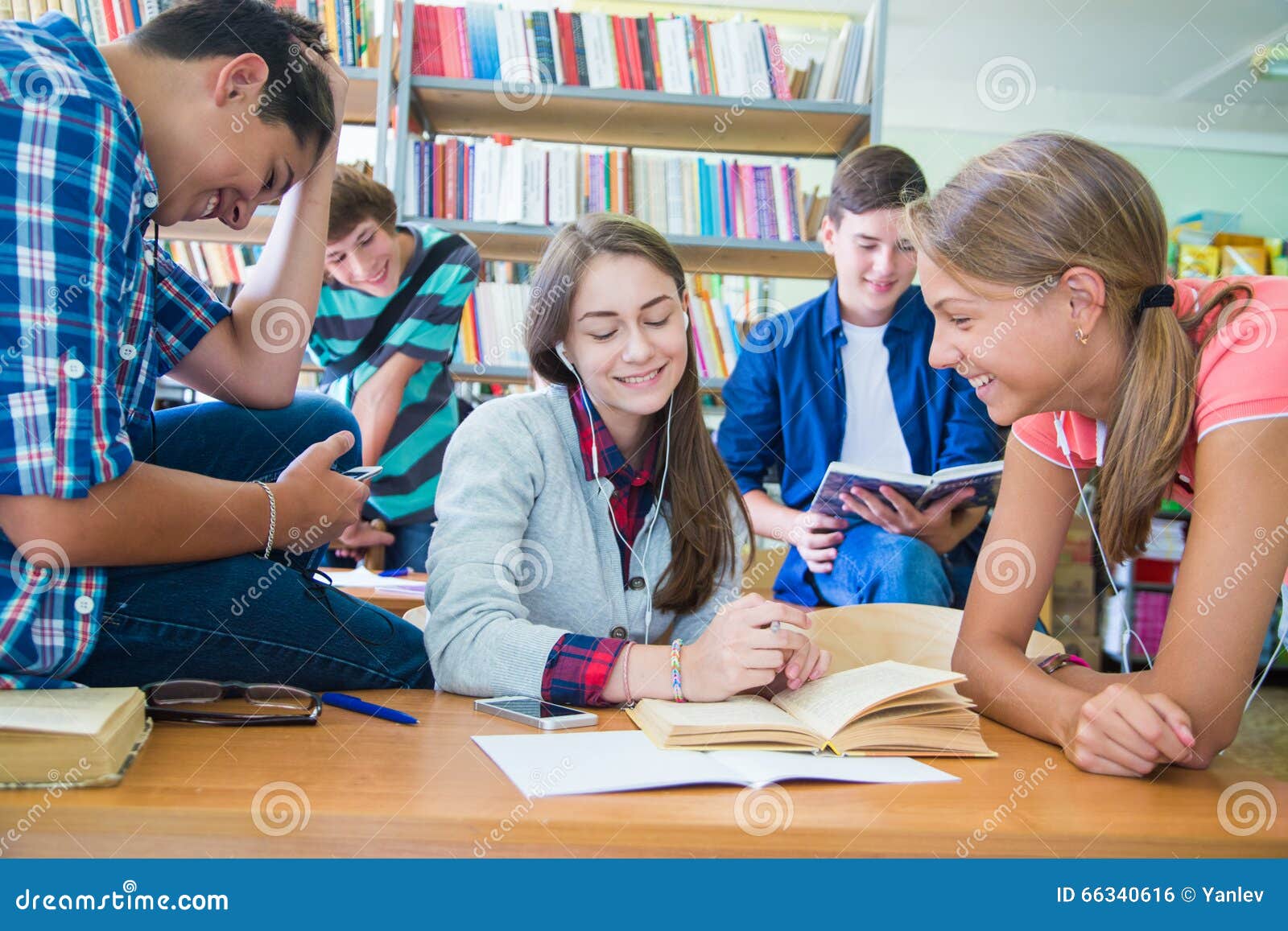 Teens in library stock photo. Image of adolescence, males - 66340616
