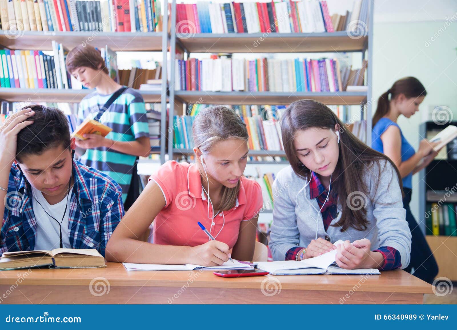 Teens in library stock image. Image of adolescence, males - 66340989