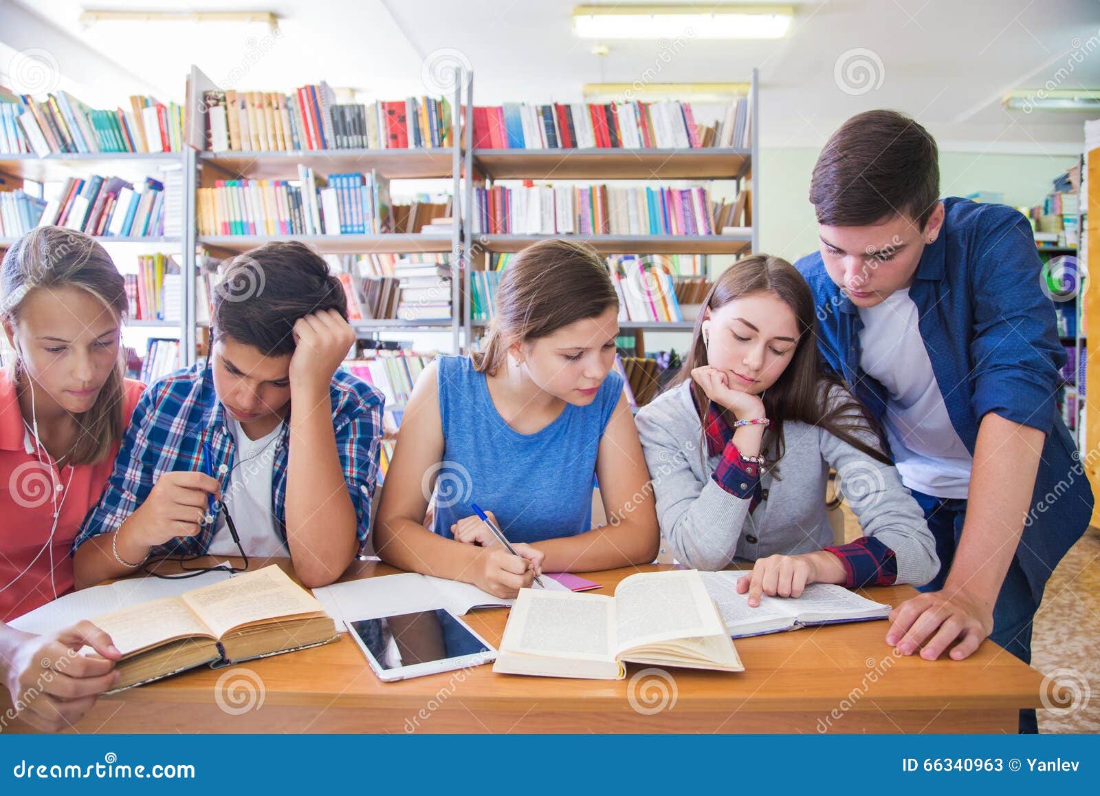 Teens in library stock image. Image of adolescence, hall - 66340963