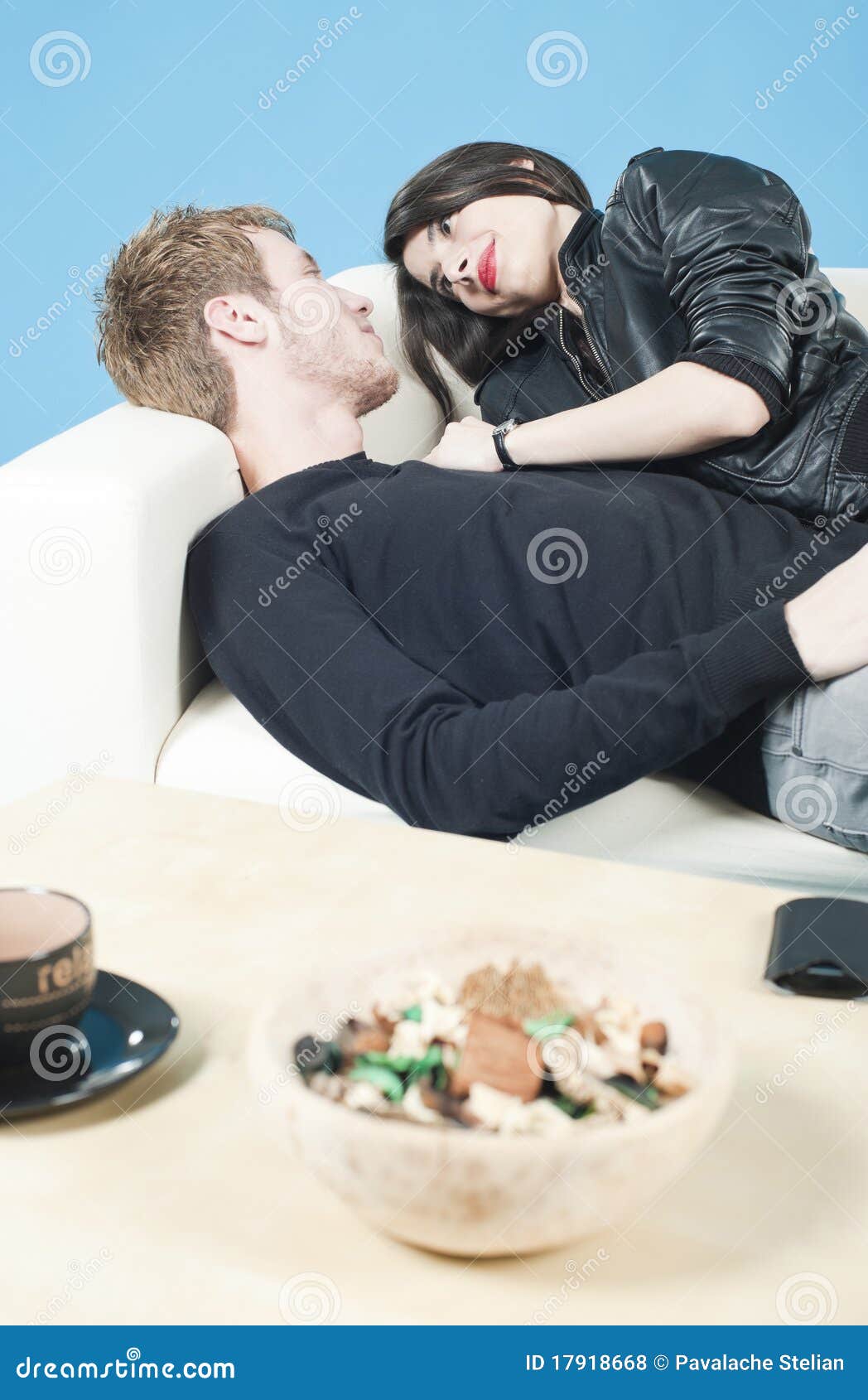 Teens Lying on the Couch Talking Happily Stock Photo - Image of happy ...