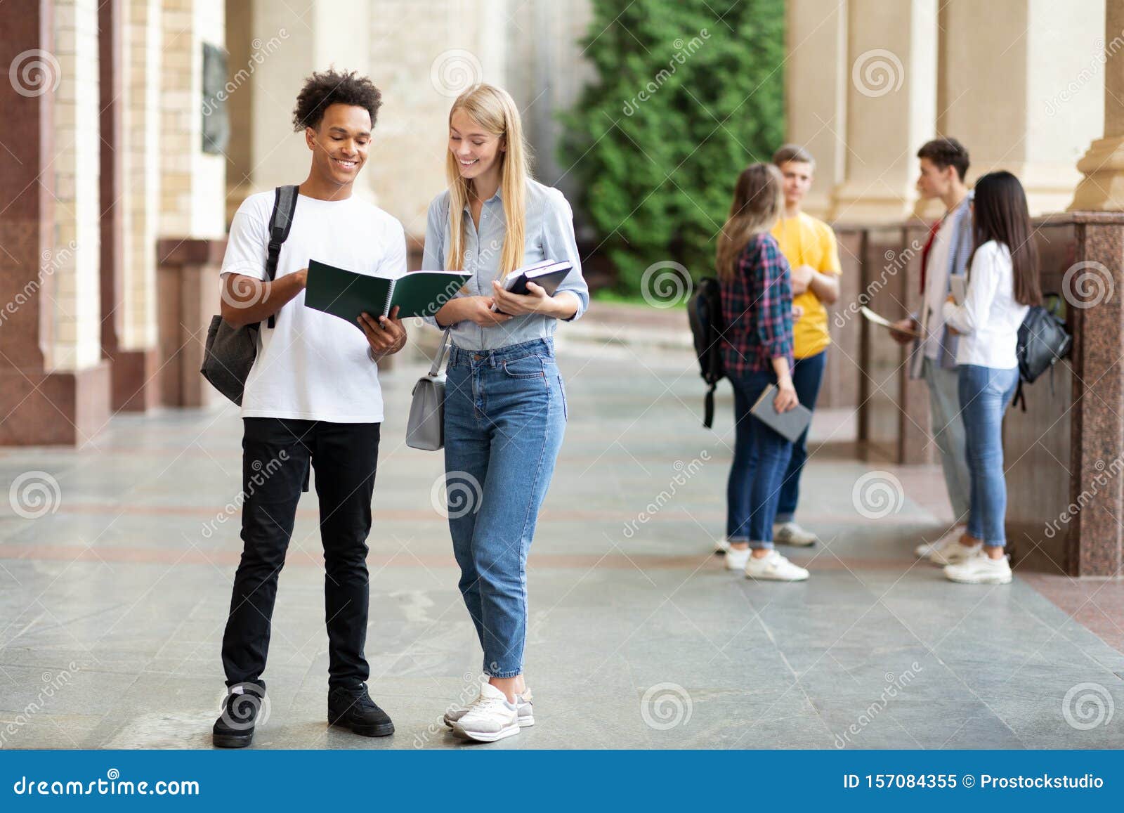 Teens Preparing for Classes with Books in University Campus Stock Image ...