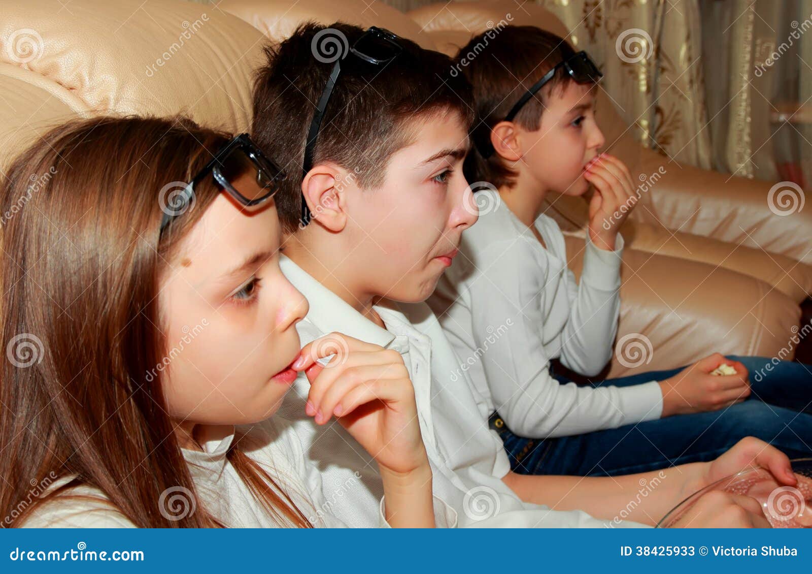 Teens in Profile with Interest Watching Movie Stock Image - Image of ...