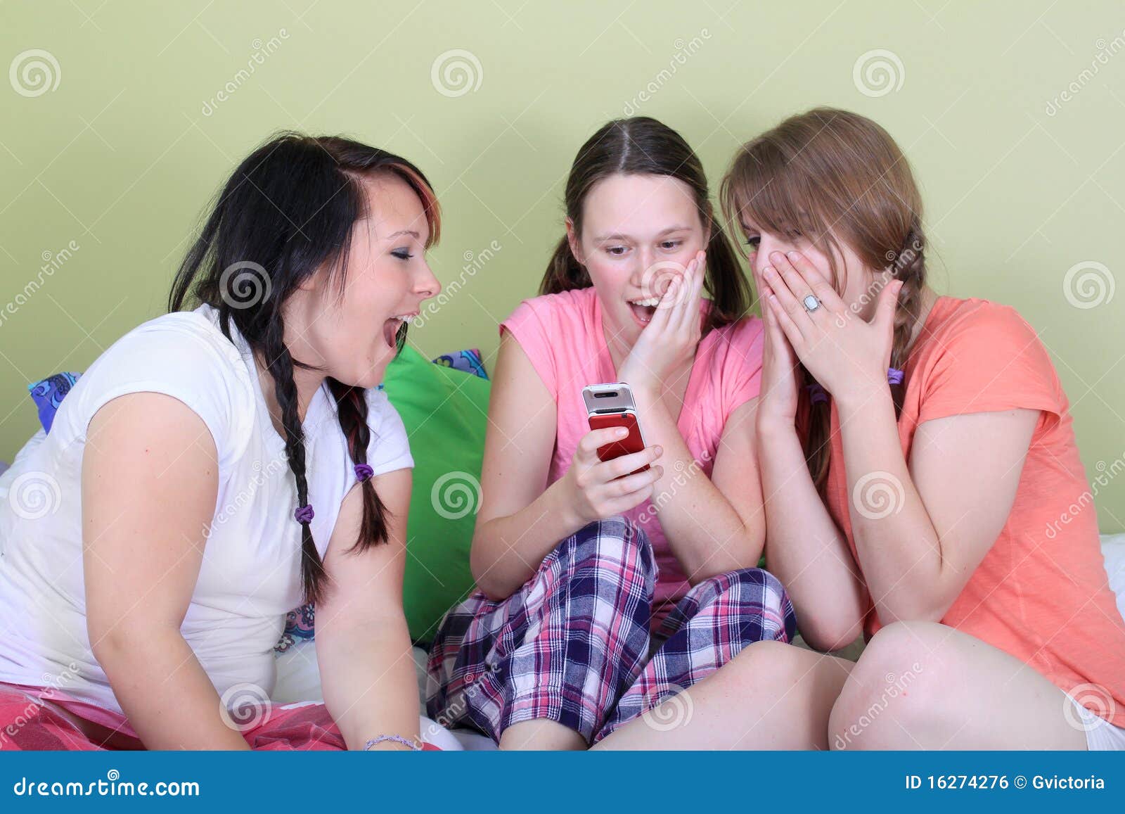 Teens Reading Text Messages Stock Photo - Image of sixteen, sleepover ...