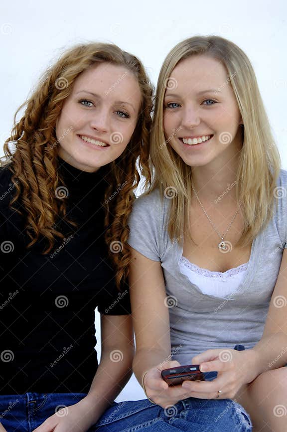 Teens sending text message stock photo. Image of friend - 7367562