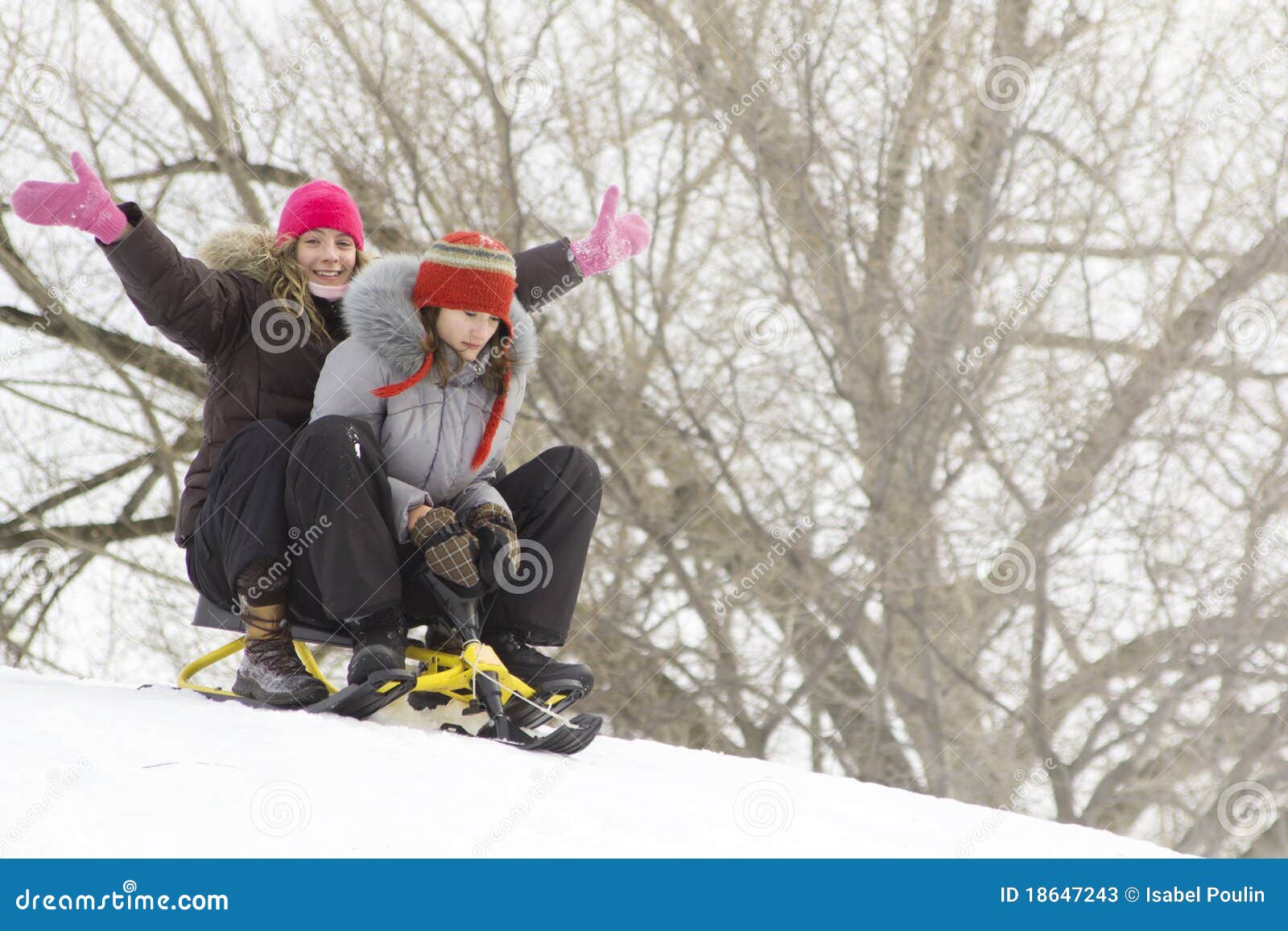 Teens sliding on snow stock image. Image of activity - 18647243