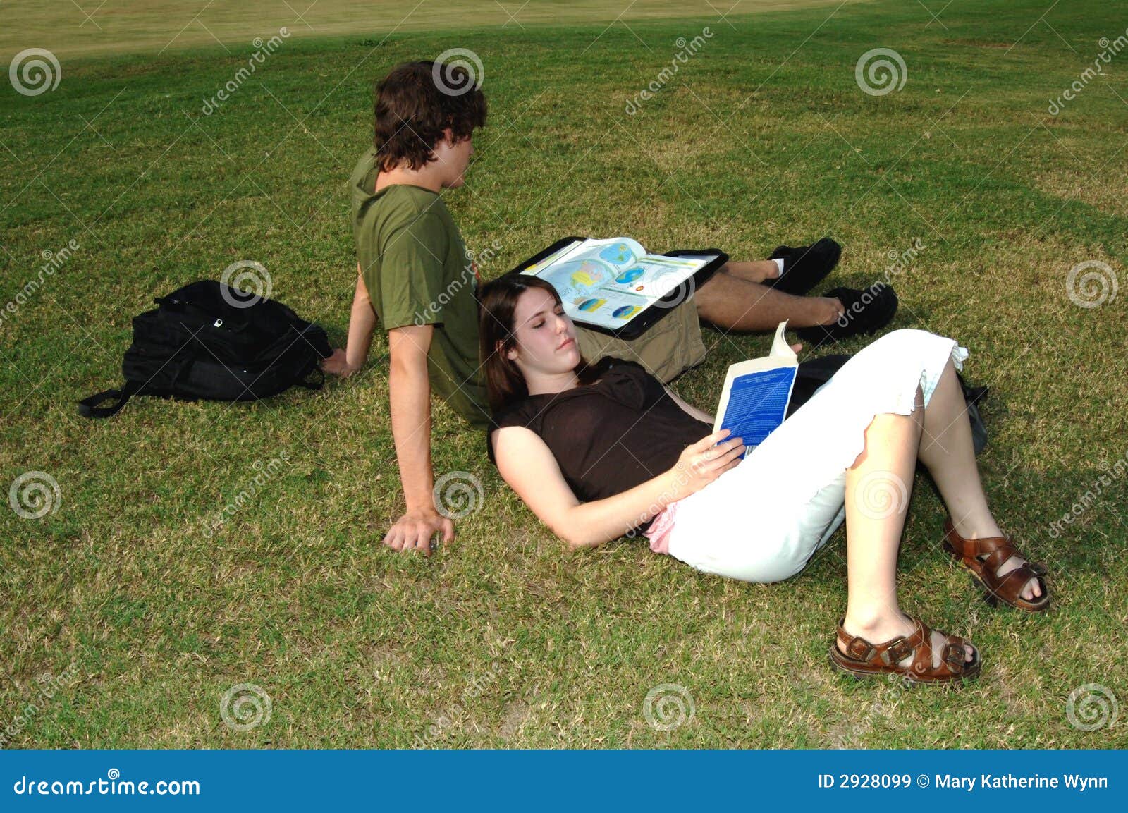 Teens studying outdoors stock image. Image of park, backpack - 2928099