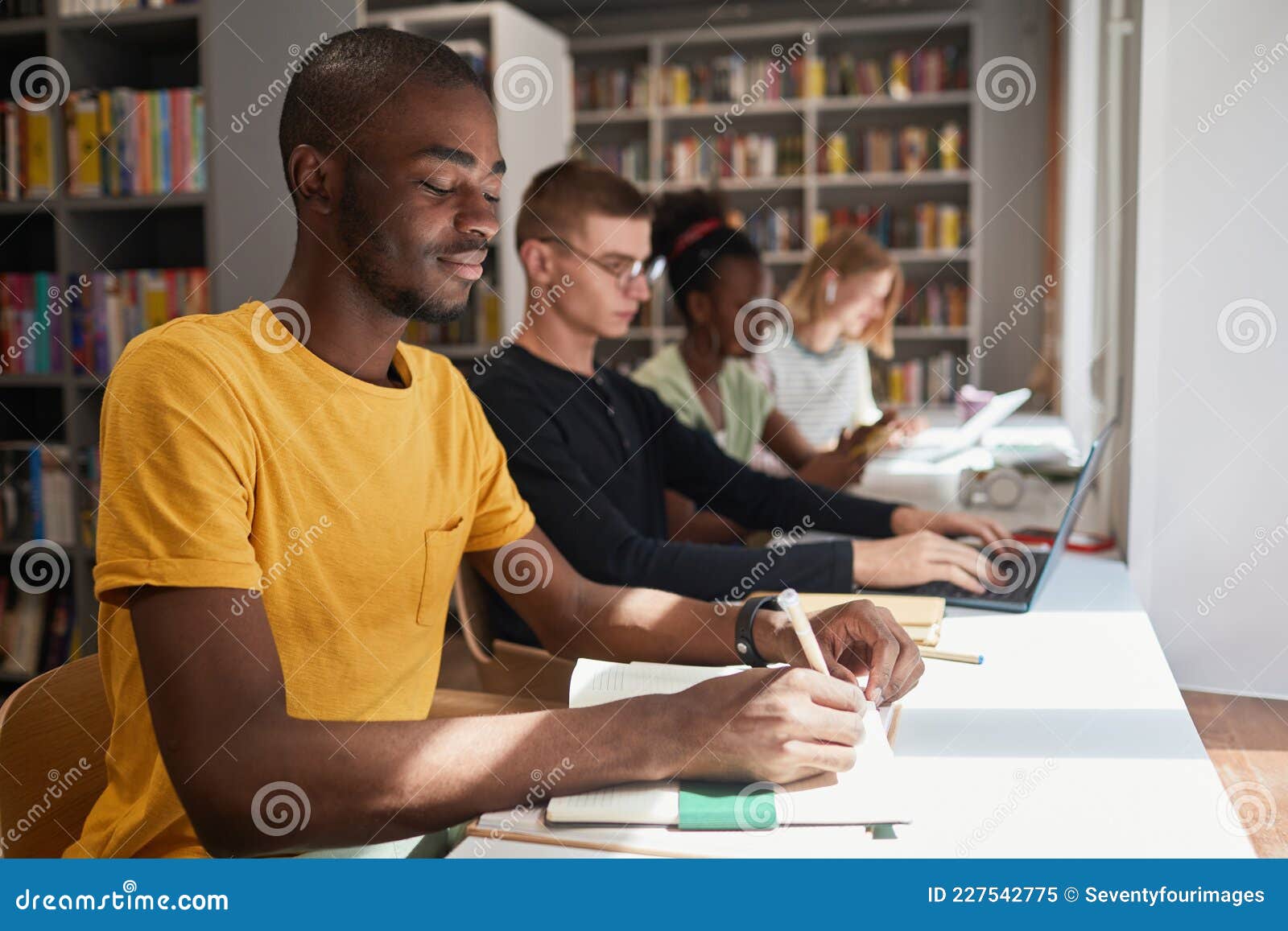 Teens Studying in Row stock image. Image of education - 227542775