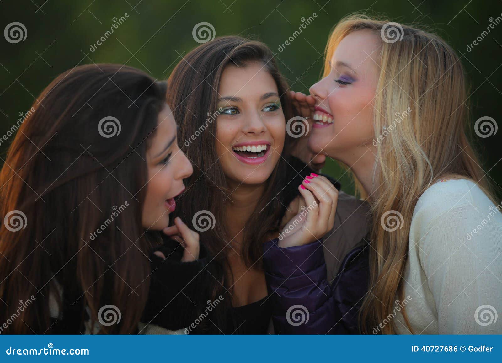 Teens whispering secrets stock photo. Image of healthy - 40727686