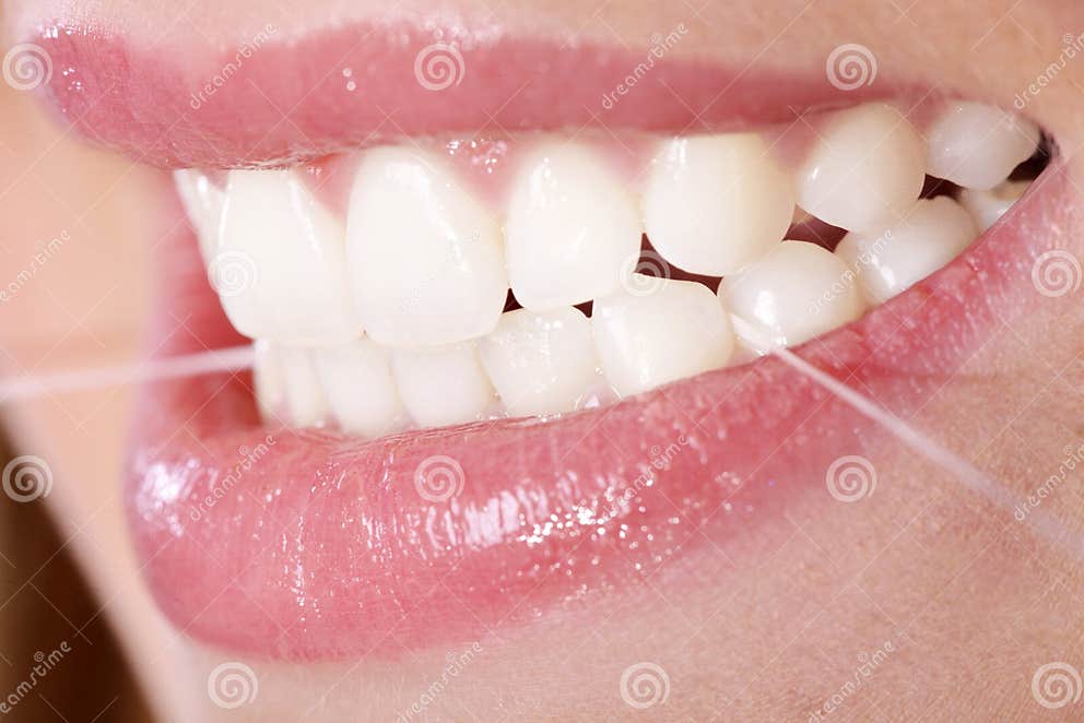 Teeth with dental floss stock image. Image of pretty - 39469647