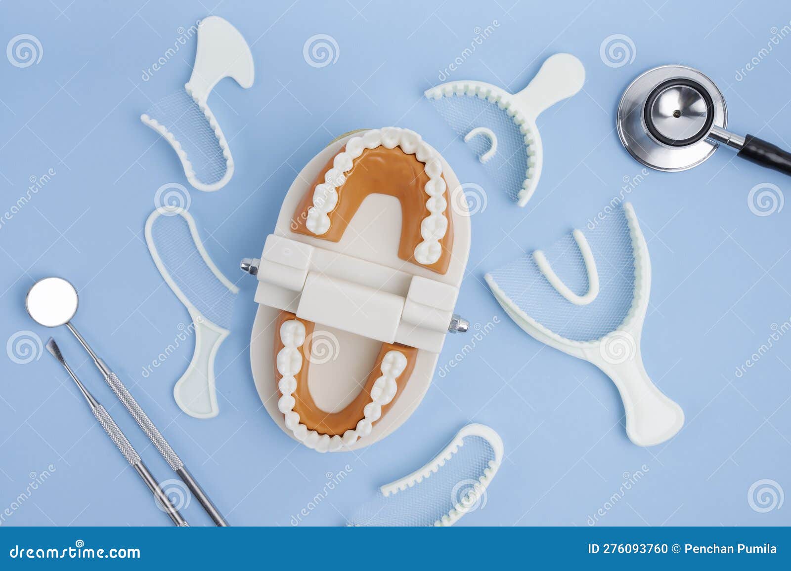 The Teeth Model and Instrument Dental on Blue Background Stock Photo ...