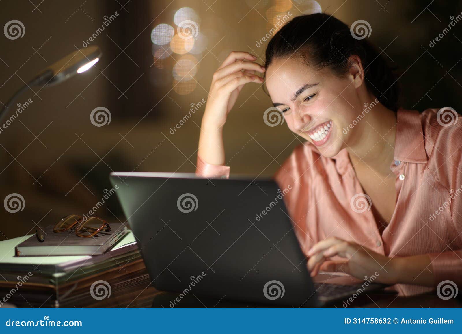 Tele Worker in the Night Laughing Checking Laptop Stock Photo - Image ...