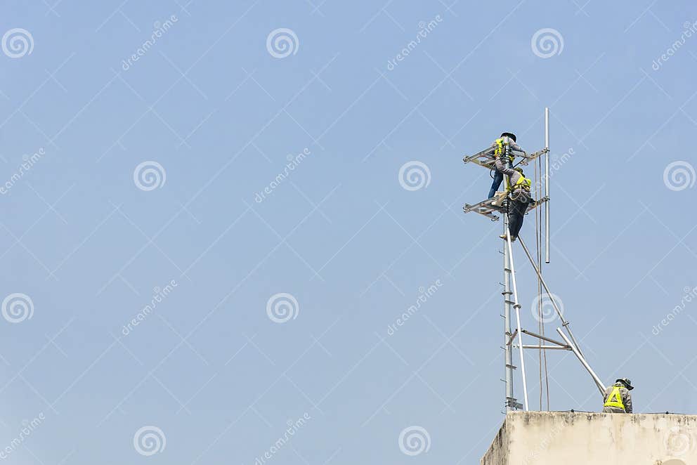 The Telecommunication Tower with the Worker Stock Photo - Image of ...