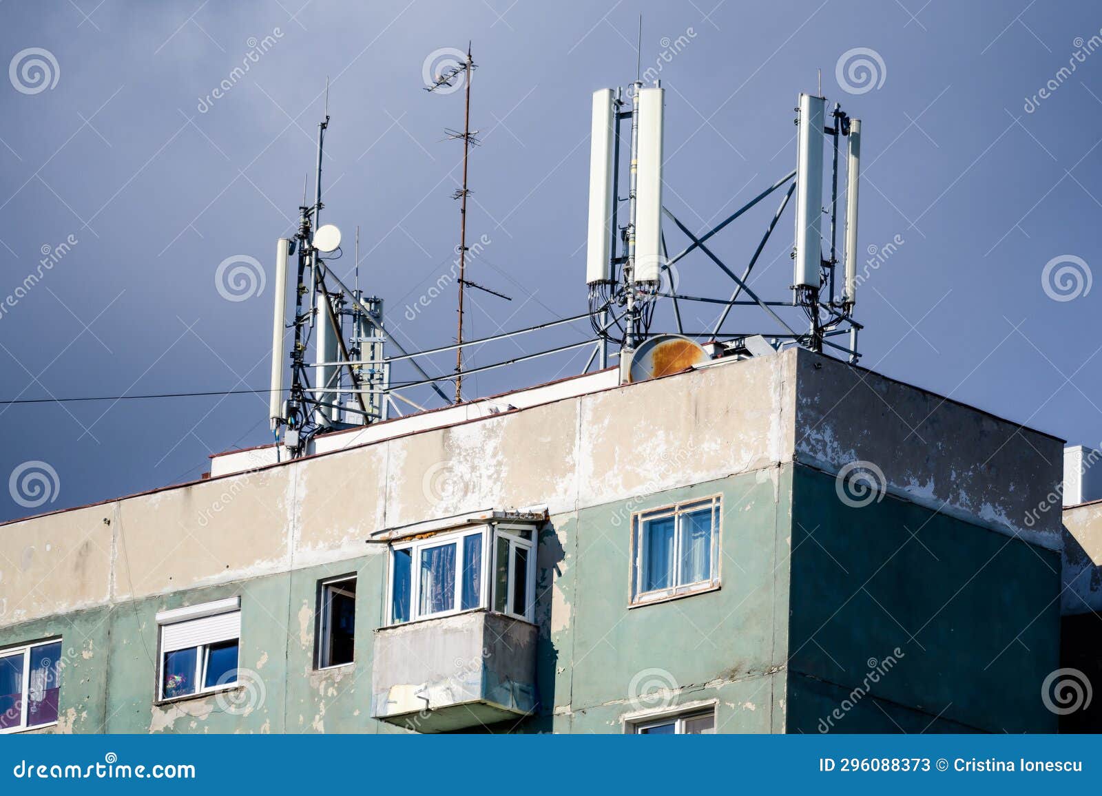 Telecommunications Antennas On The Rooftop Of A Modern Building With ...