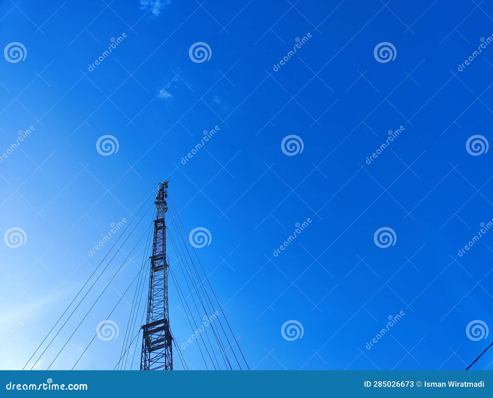 Telecommunications Tower with a Blue Sky Background Stock Image - Image ...