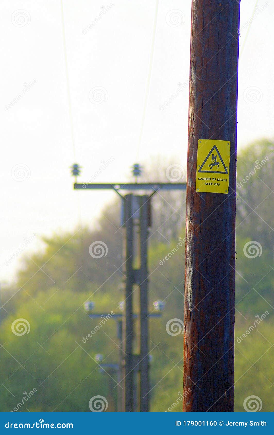 Telegraph Poles and a Danger Sign Stock Photo - Image of green, brown ...