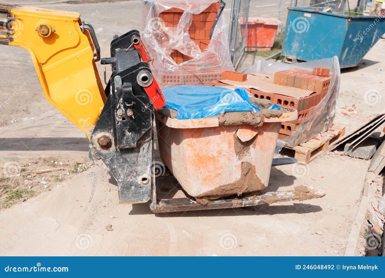Telehandler Bringing Tube with Mortar for Bricklayers Stock Photo ...