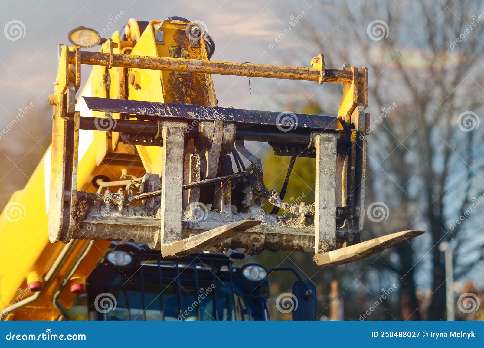 Telehandler with Raised Boom and Forks Close-up Stock Image - Image of ...
