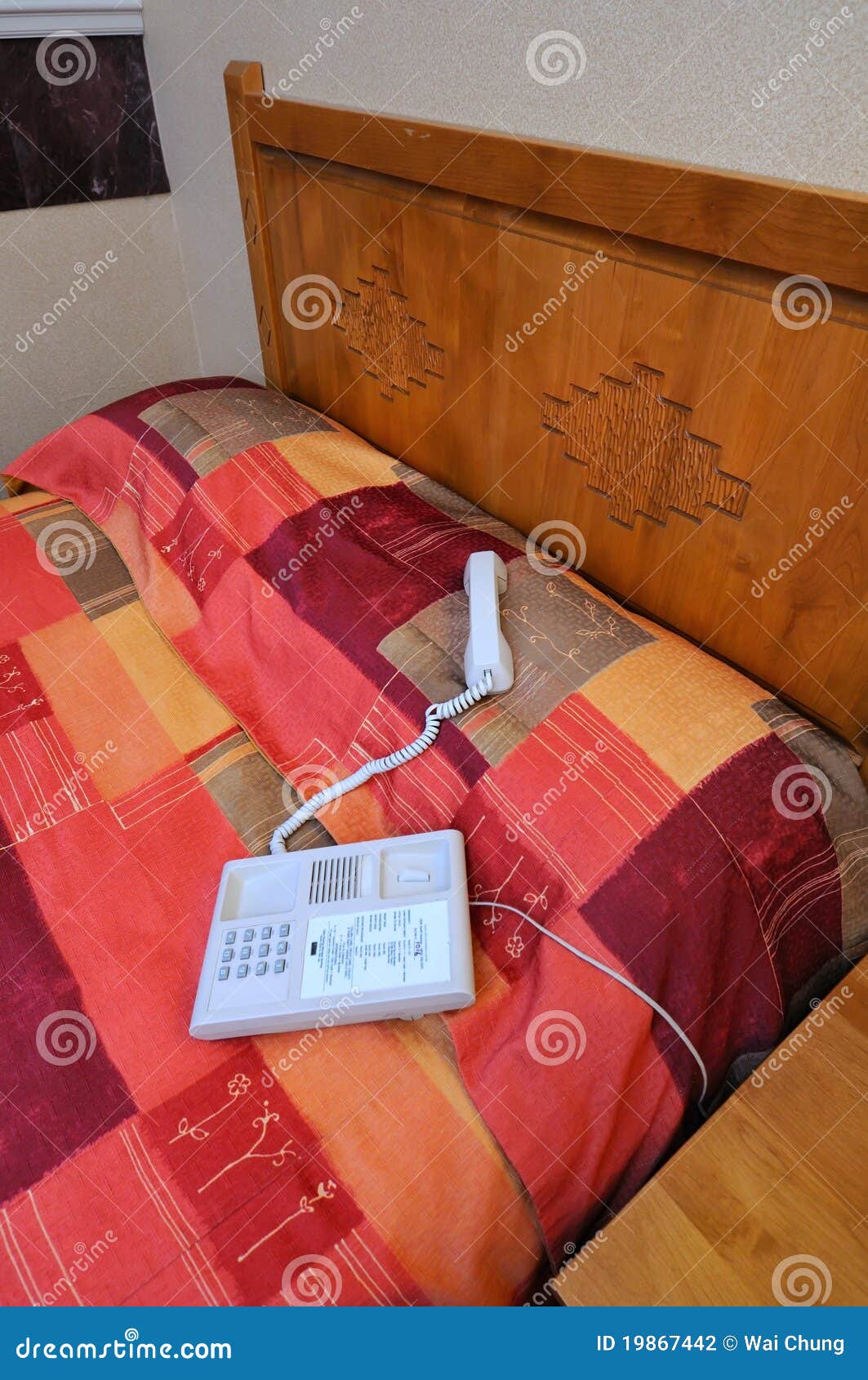 Telephone on bed stock photo. Image of room, bedroom - 19867442