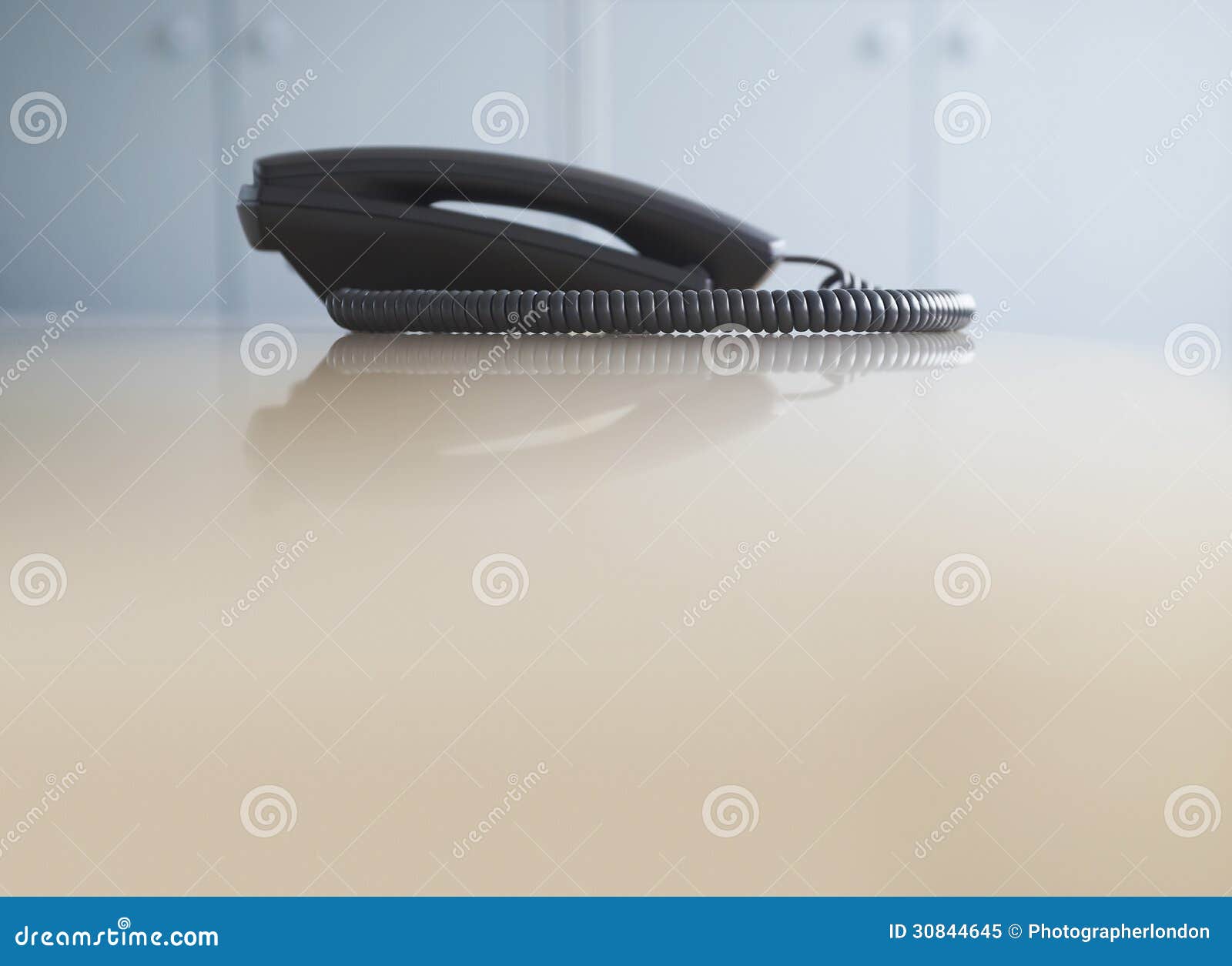 Telephone on Desk Side View Stock Image - Image of coiled, focus: 30844645