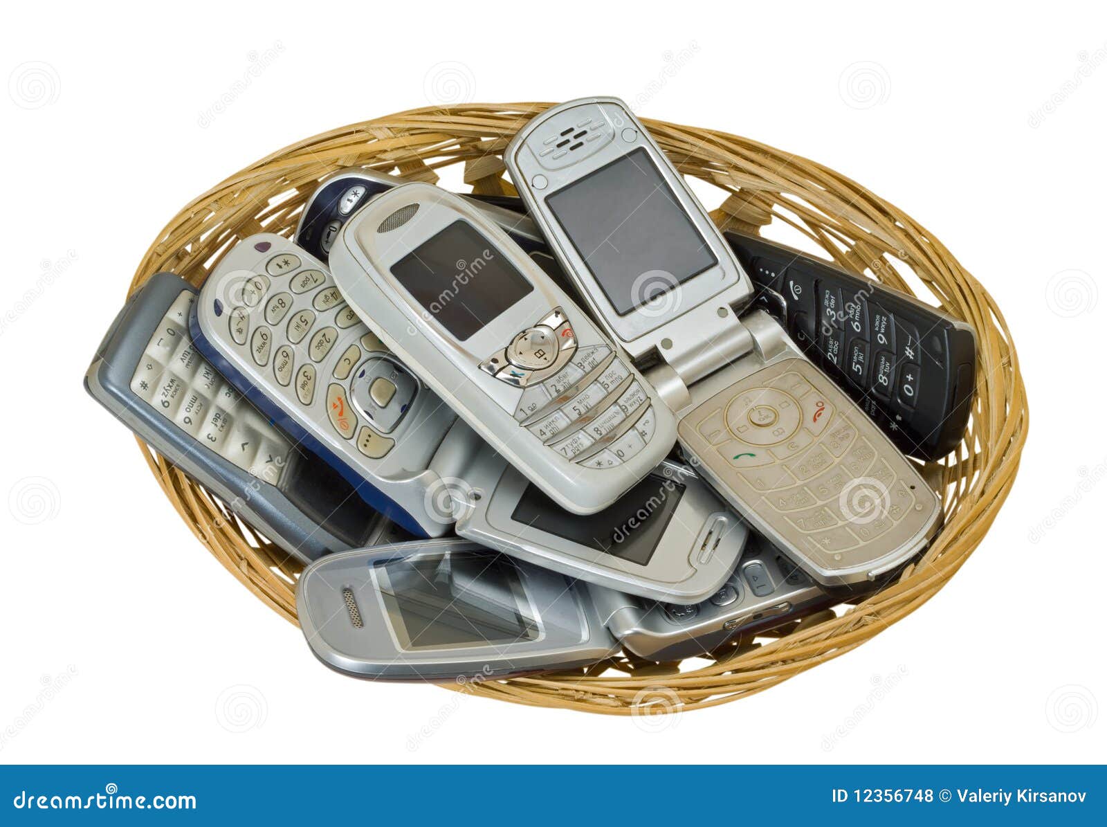Telephones in basket 1 stock photo. Image of isolated - 12356748