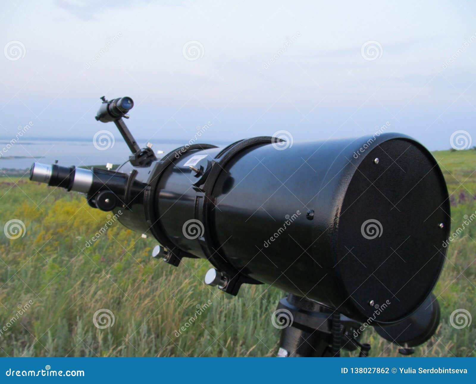The Telescope is Located in Nature and is Aimed at a Clear Spacious Sky ...