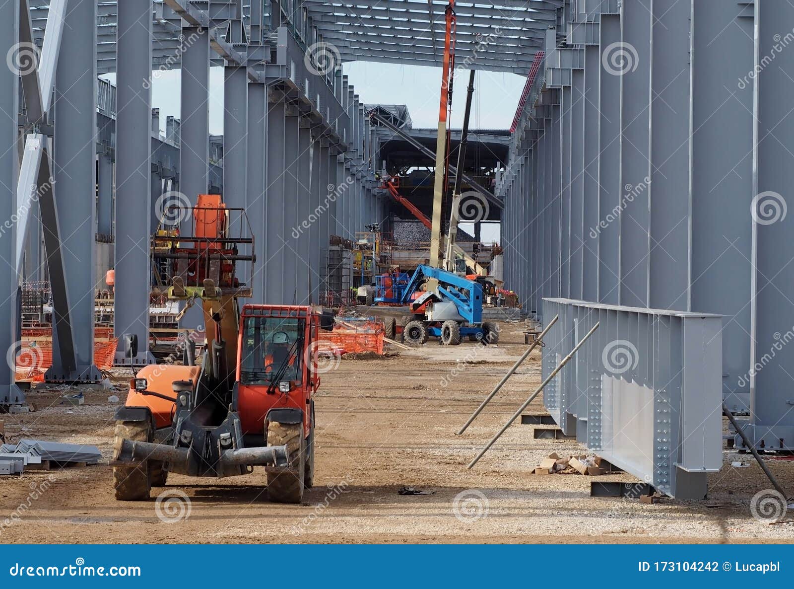 Telescopic Handler At Work Inside A Large A Large Industrial Building ...