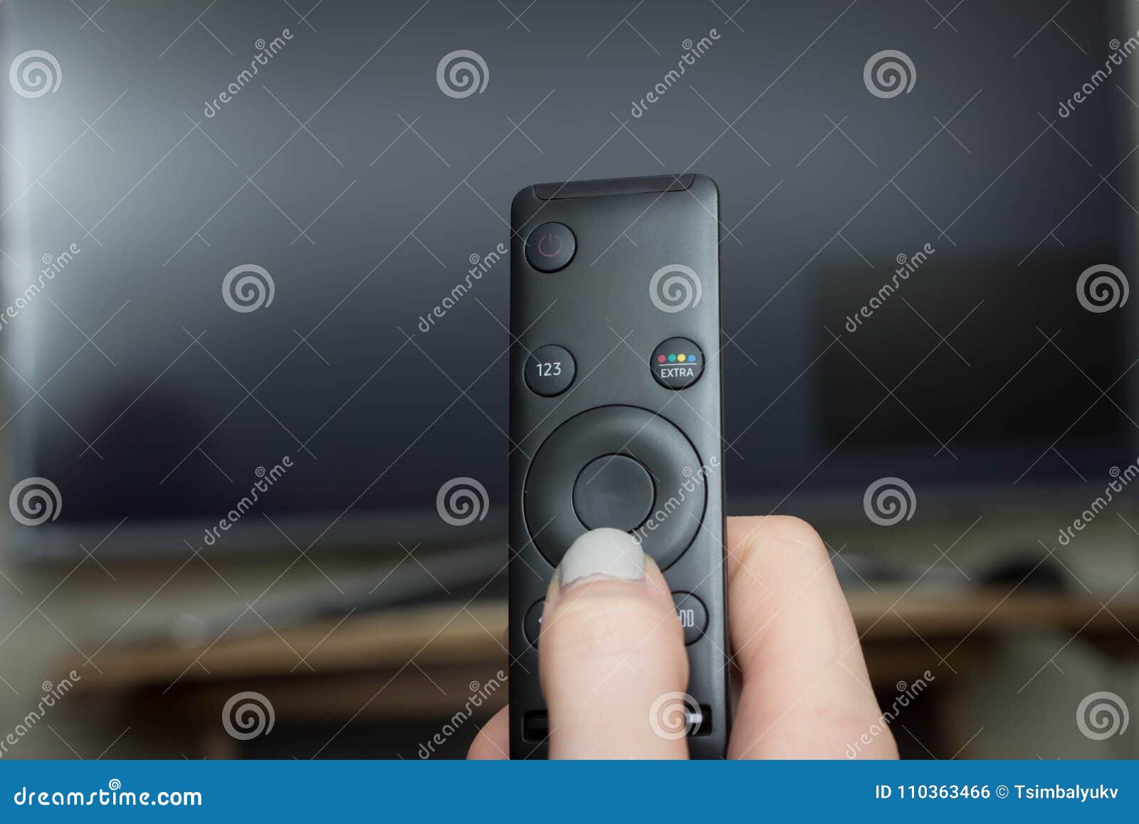 Television Remote Control Changes Channels Thumb on the Blue TV Screen ...