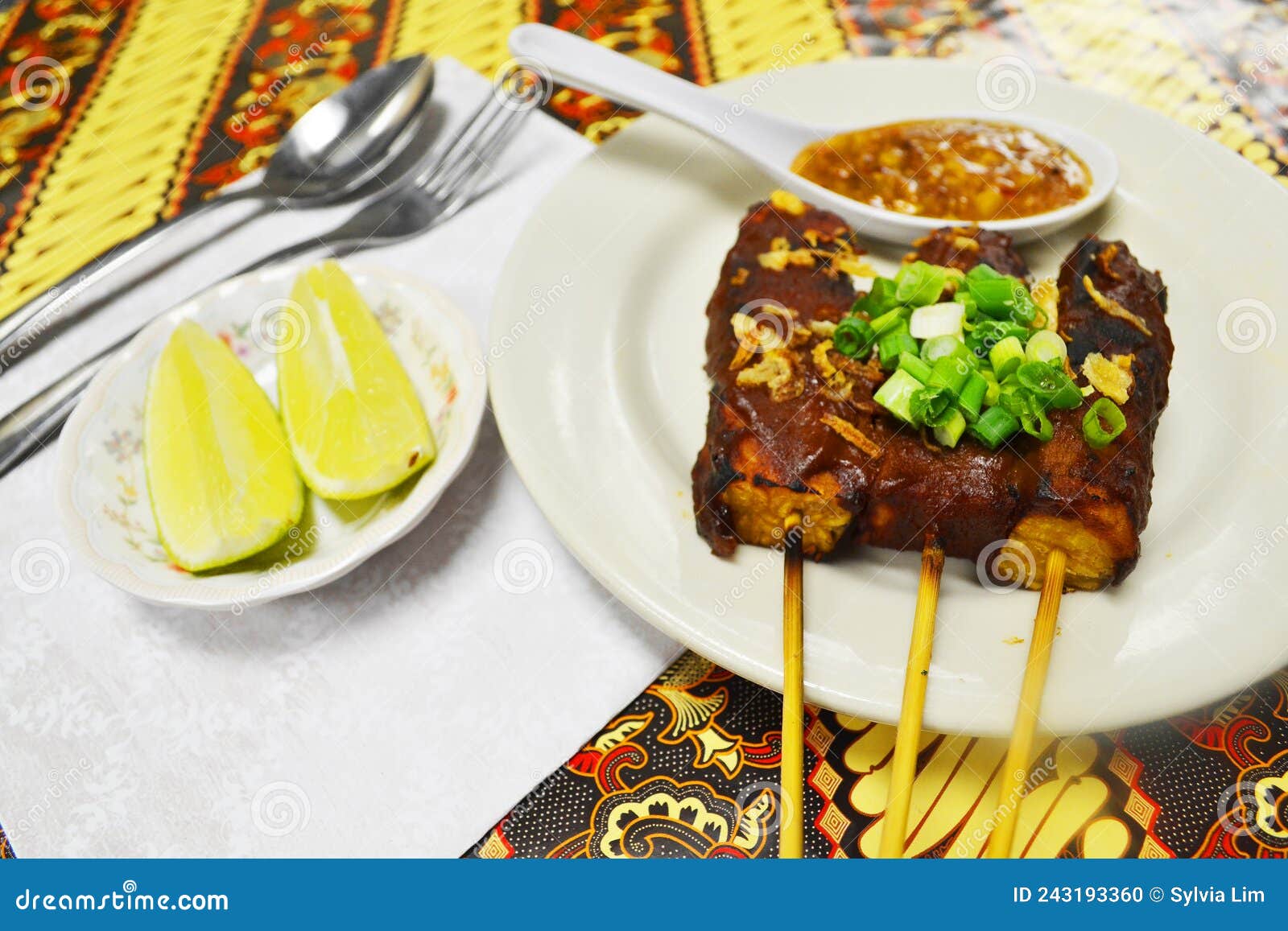 Tempeh Satay with Citrus and Peanut Sauce on Batik Pattern Table Cloth ...