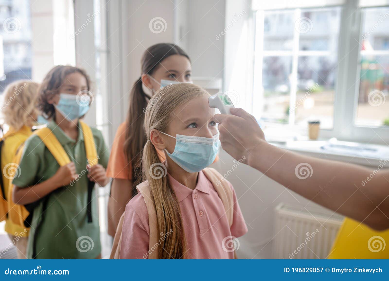 Schoolchildren Passing Temperature Control while Entering the School ...