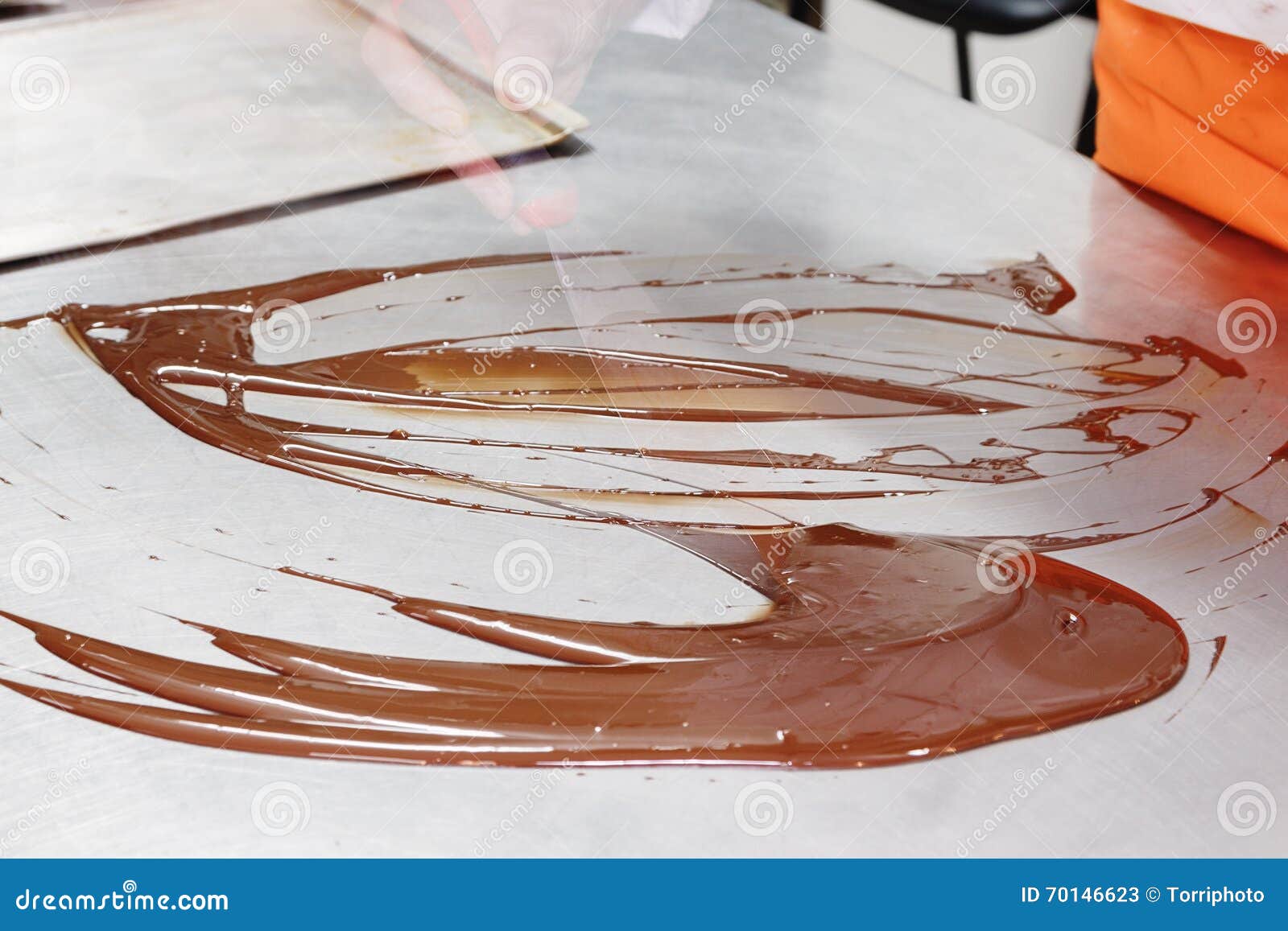 Tempering of the chocolate stock image. Image of metal - 70146623