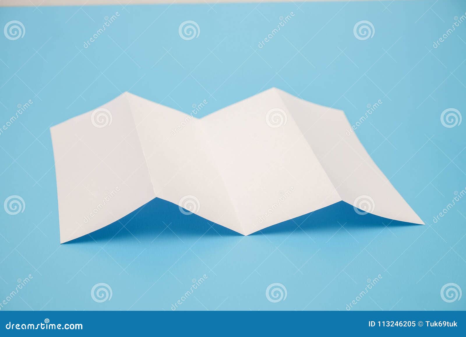 Template Fold White Paper on Blue Background Stock Image - Image of ...
