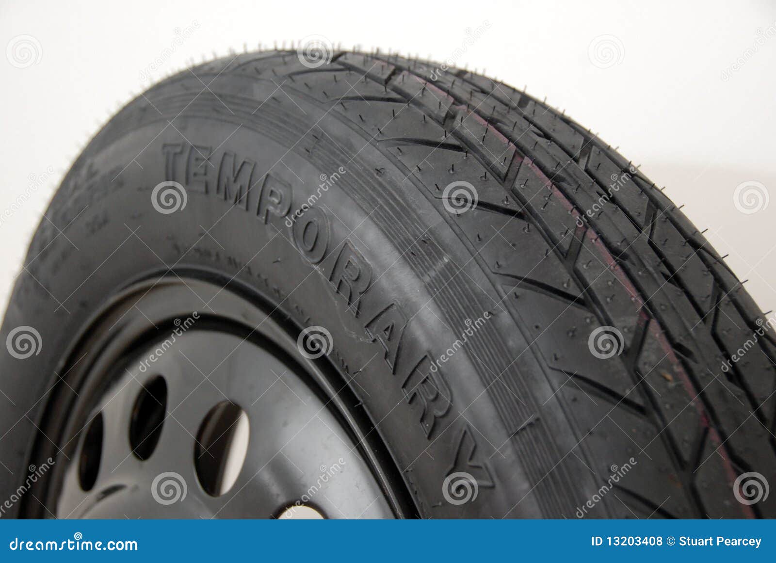 Temporary Emergency Tire Replaced Onto Car Wheel After Flat Tire ...