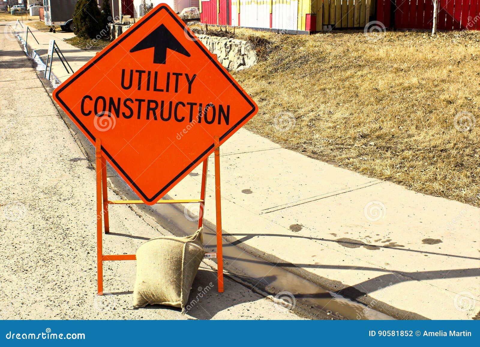 Temporary Utility Construction Ahead Sign beside a Sidewalk Stock Photo ...