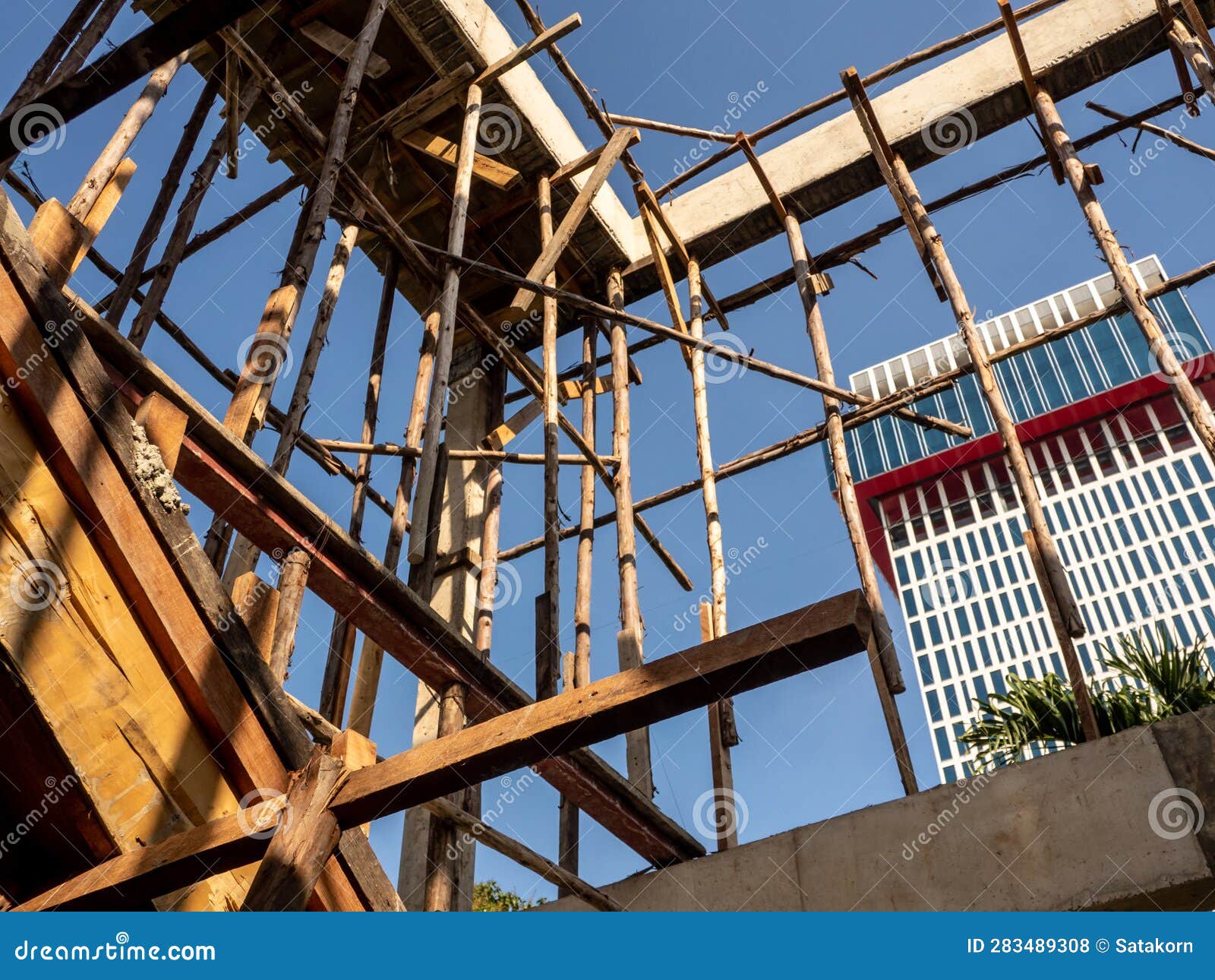 Temporary Wooden Pole for Supports the Concrete Structure a Building ...