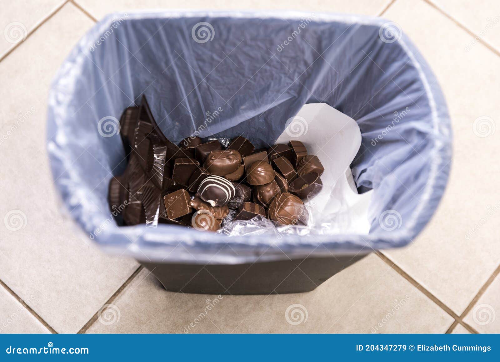 Tempting Unhealthy Chocolates Disposed of in a Garbage Can at the ...