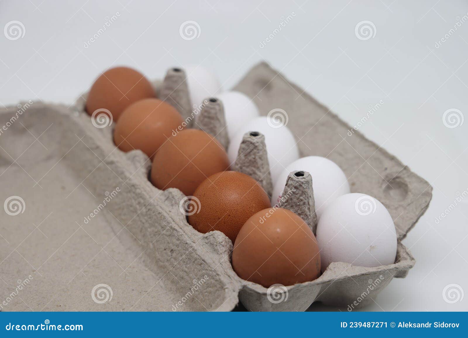 Ten Eggs in a Carton. a Dozen Raw White and Brown Eggs. Stock Image ...