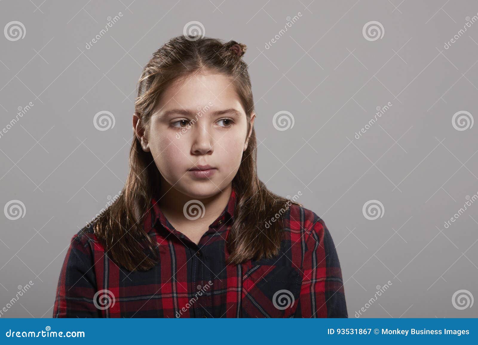 Ten Year Old Girl Looking Away From Camera Head And Shoulders Stock