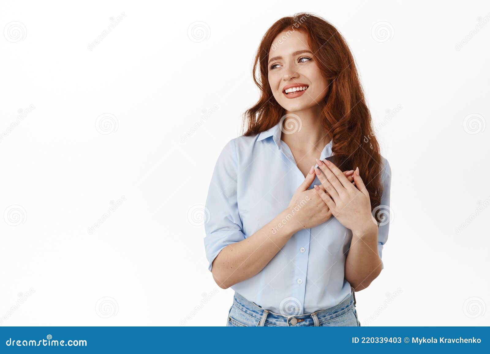 Tender And Romantic Redhead Girl Holds Hands On Heart Smiles And