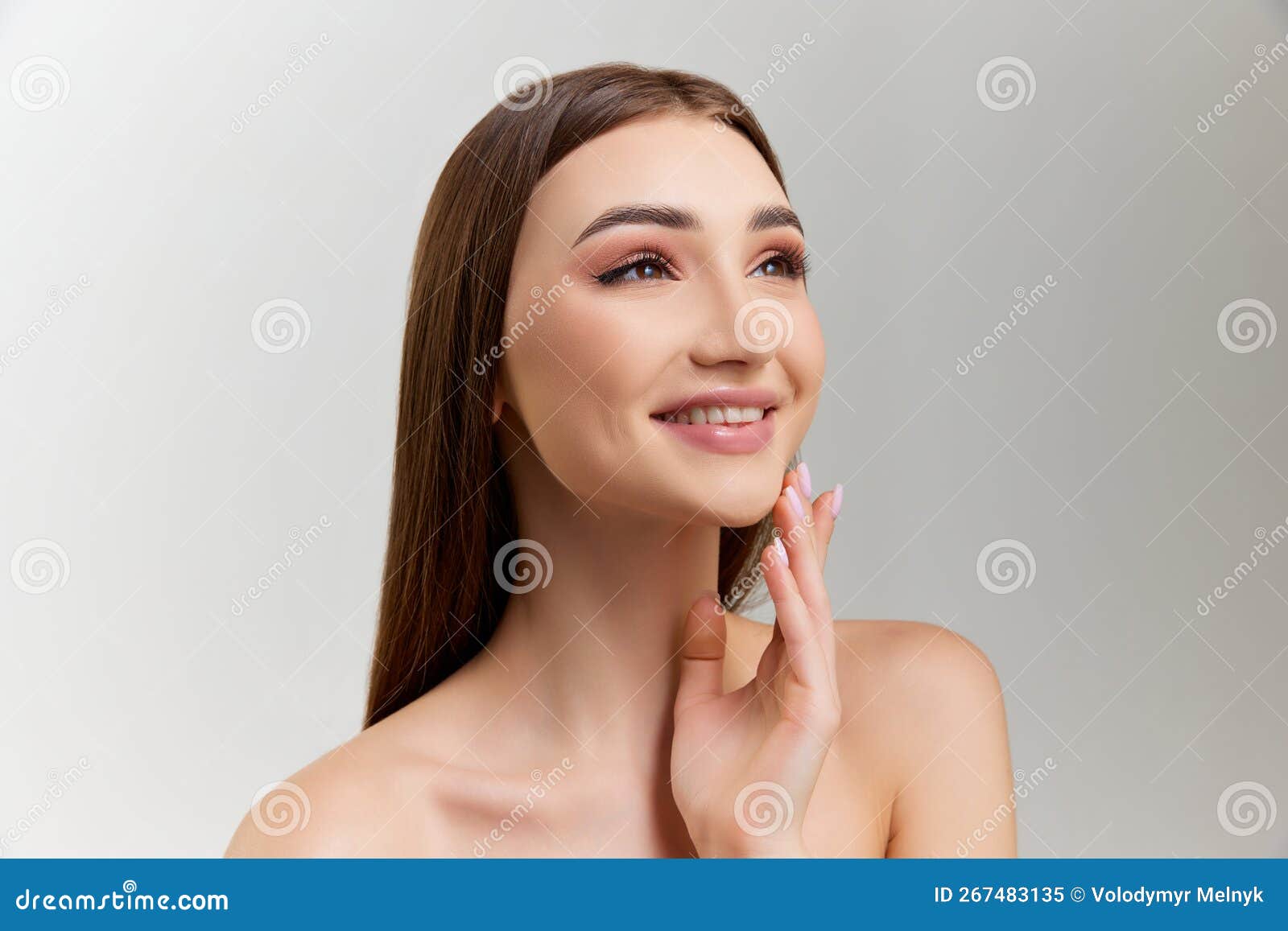 Tender Young Girl With Perfect Well Kept Skin And Nude Makeup Posing