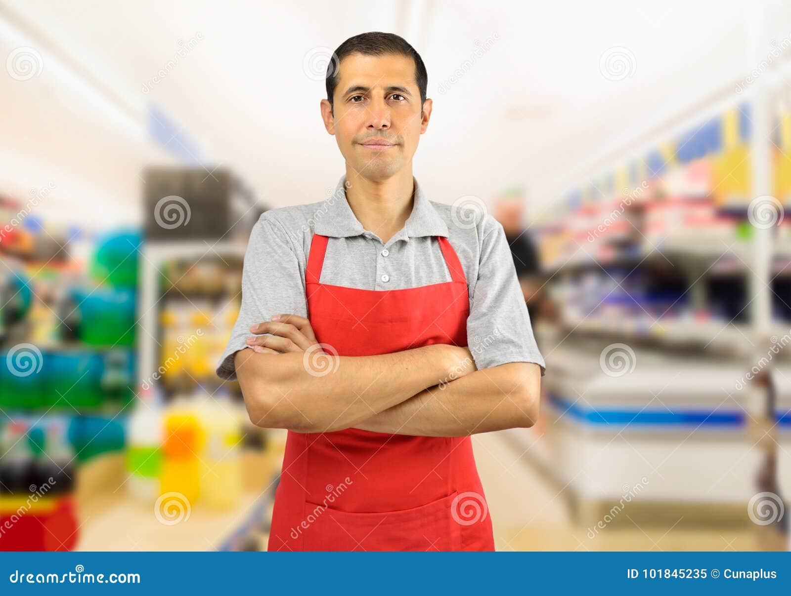 Tendero en el supermercado imagen de archivo. Imagen de delantal ...