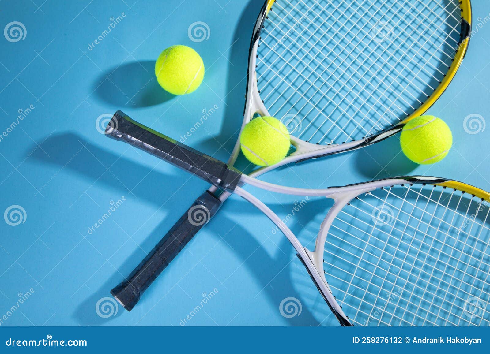 Tennis Ball and Rackets on the Blue Background Stock Photo - Image of ...