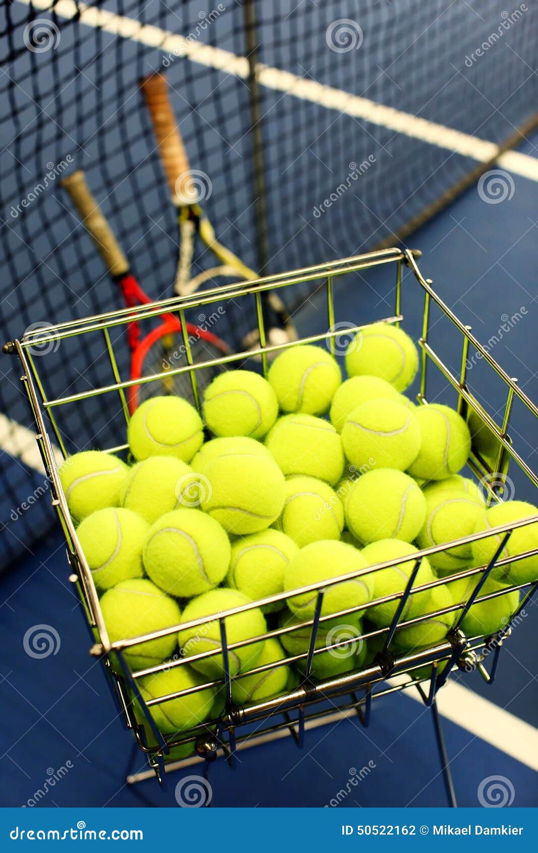 Tennis balls in a basket stock photo. Image of court - 50522162
