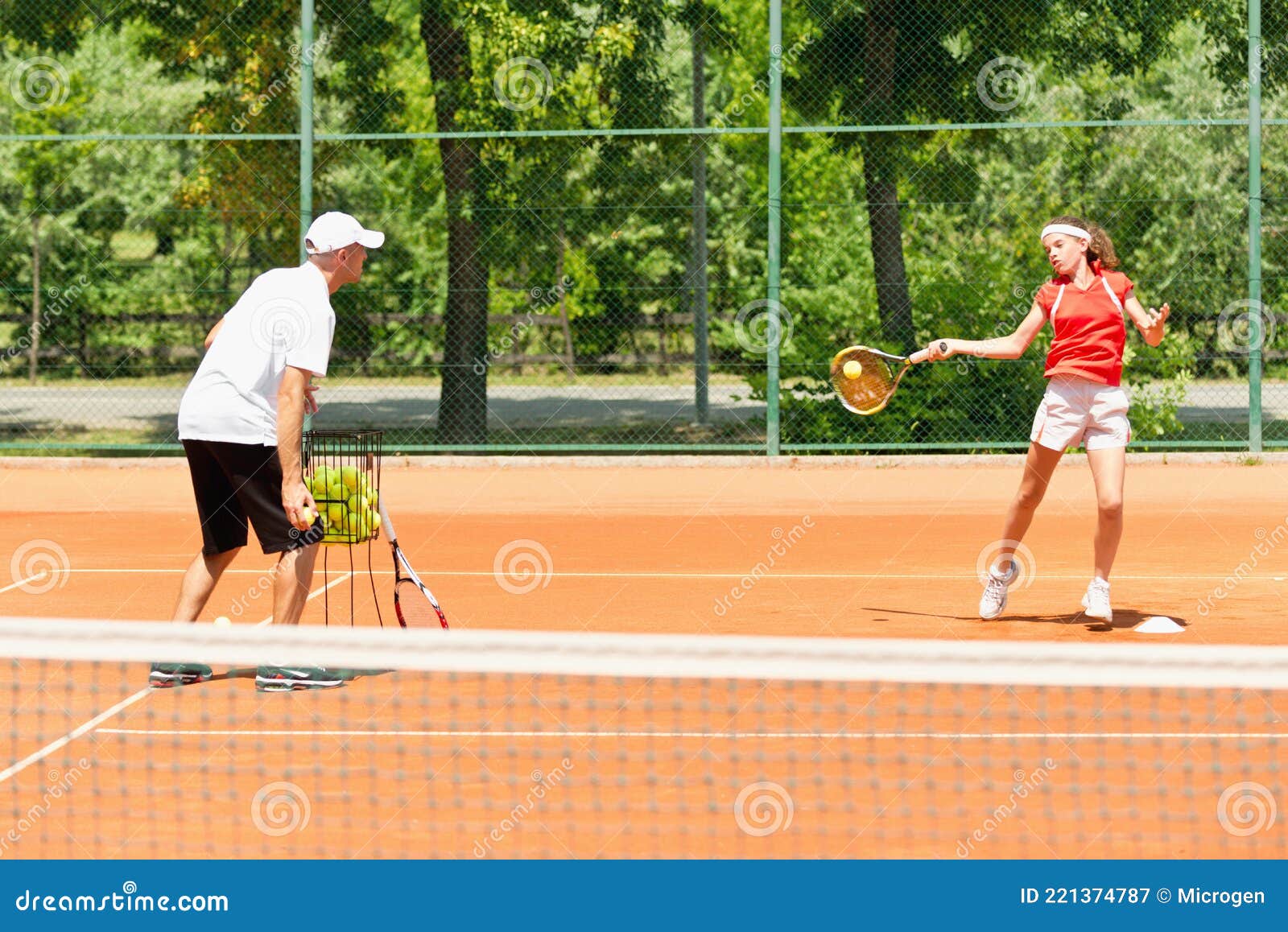 Tennis lesson stock image. Image of forehand, training - 221374787